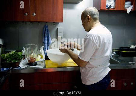 Galley kitchen of Container Ship with Crew Chef smiling preparing meal ...
