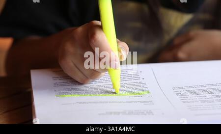 Student Highlighting A Page Stock Photo - Alamy