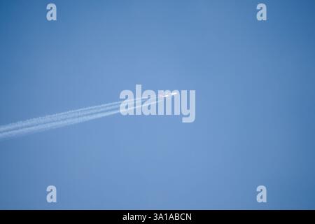 high altitude quad engine contrails (jet airplane vapour trails) across ...
