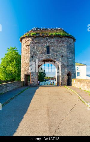 Buildings and houses standing on the shore of a lake, river or sea ...