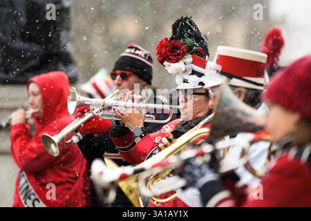 Members of the Wisconsin marching band perform before an NCAA college ...
