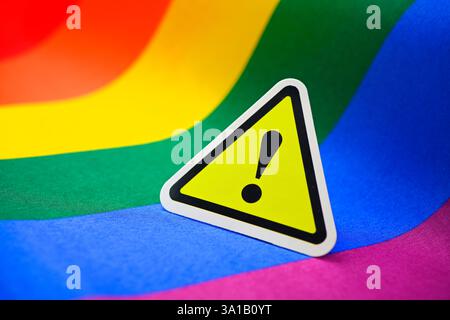 Warning sign on rainbow flag, LGBTQ, wokeness and anti-wokeness Stock ...