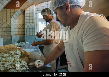 Istanbul, Turkey, Turkiye. Bakers Roll the Dough for Simit, Traditional ...