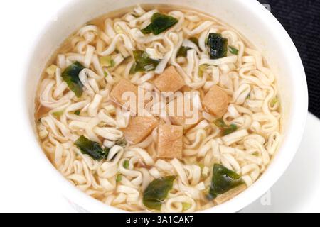boiled instant Udon noodles in a cup on white background Stock Photo ...