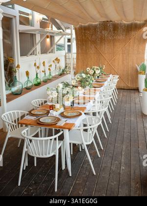 Beautiful table setting with floral decor on light background with ...