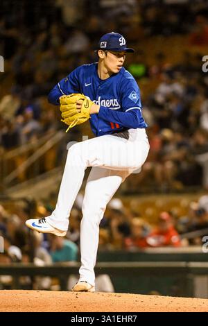 Los Angeles Dodgers' Roki Sasaki (11) watches his team play in the ...