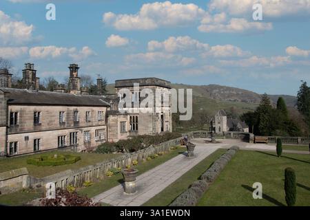 Ilam Hall and gardens looking toward Ilam Church and Thorpe Cloud in ...
