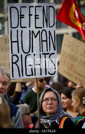 People participate in the Women's March on Saturday, January 18, 2020 ...