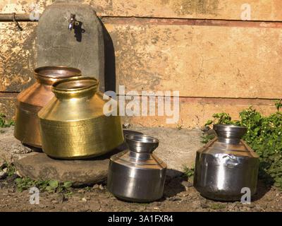 Clean pots waiting for streamline flow of water from tap Stock Photo ...