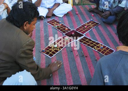 People playing chausar ancient game chopad ; Jodhpur ; Rajasthan ...