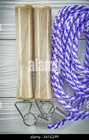 Jump rope with wooden handles on wood board fitness concept Stock Photo ...