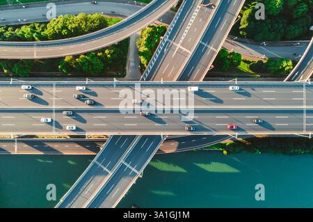 Aerial of vehicles navigate a complex highway system, showcasing ...
