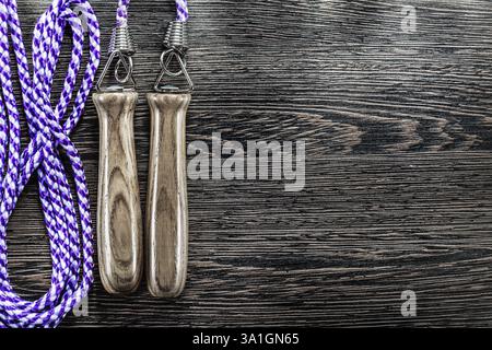 New jumping rope on vintage wooden board Stock Photo - Alamy