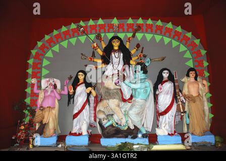 Durga clay model killing demon mahishasura with statues of kartikeya ...