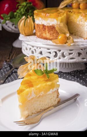delicious cakes with Physalis, fresh apples and cream Stock Photo - Alamy