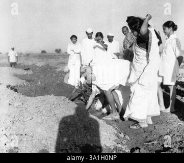Mahatma Gandhi planting tree with Abha Gandhi, Wardha, Maharashtra ...
