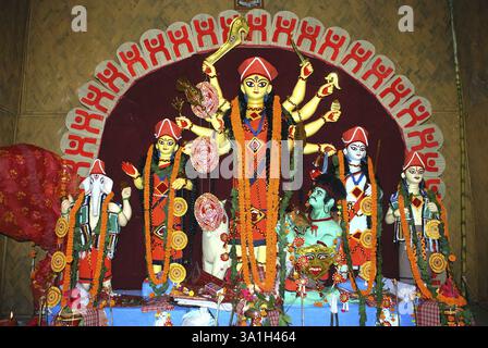 Durga clay model killing demon mahishasura with statues of kartikeya ...