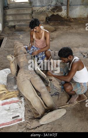 Sculptors carved bronze icon with chisel Stock Photo - Alamy