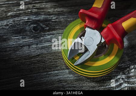 Insulation tape cutting pliers on wooden board Stock Photo - Alamy
