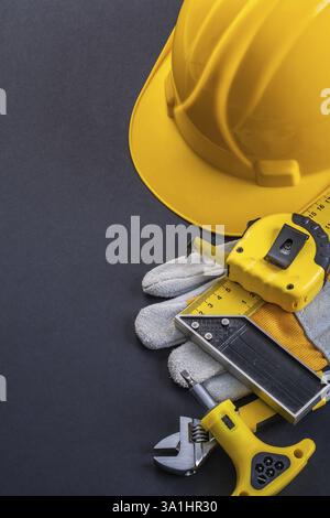screwdriver, tapeline and helmet Stock Photo - Alamy