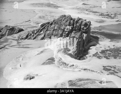 Rock on wet sand, Porbandar area of Gujarat, India, Asia Stock Photo ...