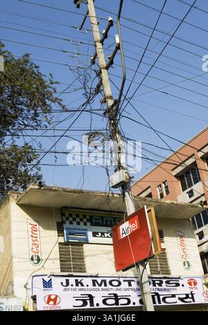 A messy tangle of cables on a street pole in Phnom Penh, Cambodia ...