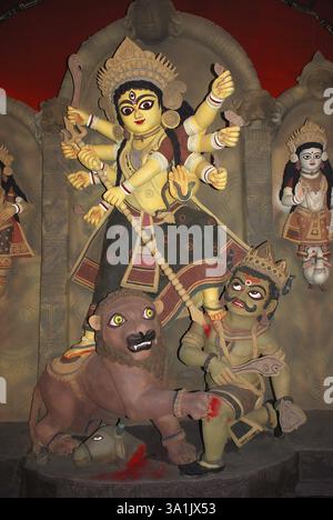 Decorative Durga clay model killing demon mahishasura with statues of ...
