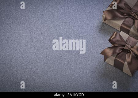 Packed giftboxes on grey background holidays concept Stock Photo - Alamy