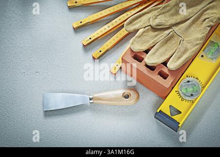 Red brick protective gloves palette knife construction level on ...