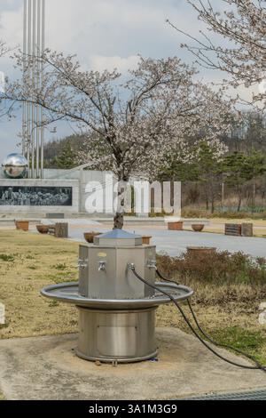 Hwanggan, South Korea, April 10, 2020: Two wooden waterwheels in front ...