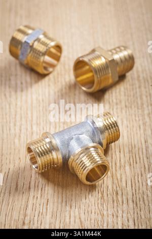 plumbers fixtures on woodenboard Stock Photo - Alamy