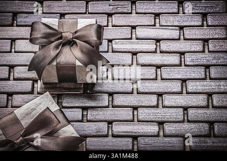 Presents packed with tied ribbons on wooden mat holidays concept Stock ...