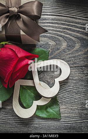 Red rose hearts packed gift box on wooden board holidays concept Stock ...