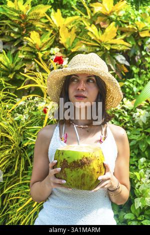glad young woman in straw hat and sunglasses on yellow background Stock ...
