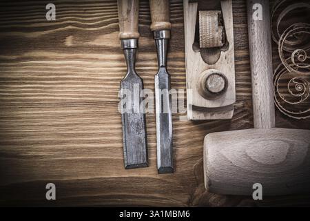 Planer planning chips on vintage wooden board construction concept ...