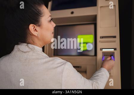 woman Using ATM at night Stock Photo - Alamy
