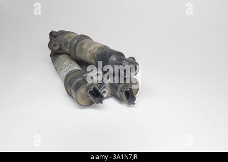 coil on plug coils, piled, showing 3-prong blade male terminal ...