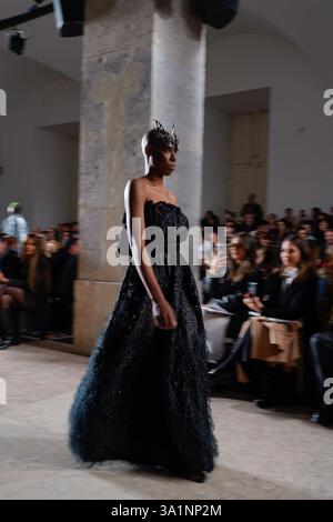 Lisbon, Portugal. 08th Mar, 2025. A model walks the runway during ...