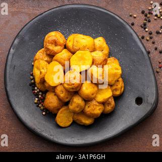Crispy fried creole potatoes with salt - Solanum phureja Stock Photo ...