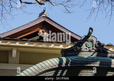Traditional Japanese ornate wooden roof overhang with gold decoration ...