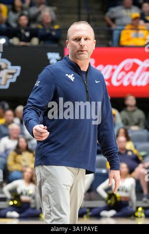 West Virginia head coach Darian DeVries talks to his players during the ...