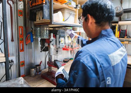 technician drilling steel Stock Photo - Alamy