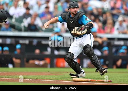 Miami Marlins catcher Liam Hicks, left, and relief pitcher Tyler ...