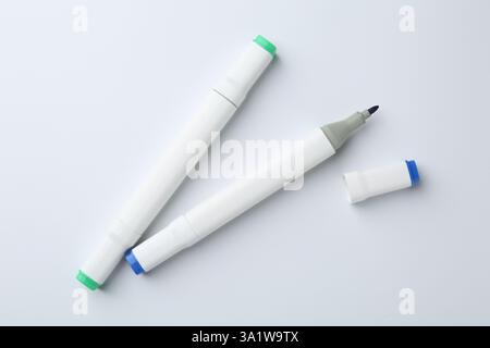 Colorful double sided markers on yellow background, flat lay Stock ...