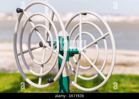 Public exercise machine with rotating wheels designed Stock Photo - Alamy