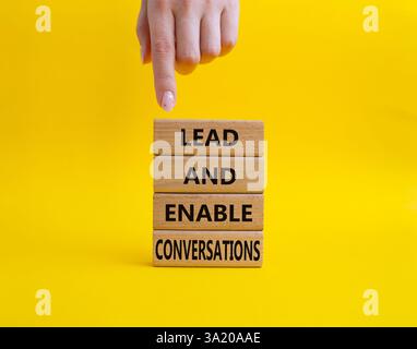 Lead and enable conversations symbol. Concept words Lead and enable ...