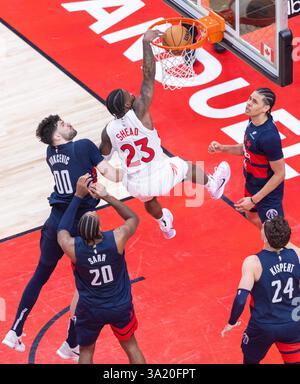Toronto, Canada. 10th Mar, 2025. Toronto Raptors forward Scottie Barnes (4) drives past ...