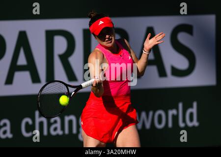 Elina Svitolina of Ukraine plays a forehand return to Wang Xinju of ...