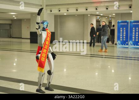 A Unitree G1 humanoid robot greets passers-by during the MWC26 in ...
