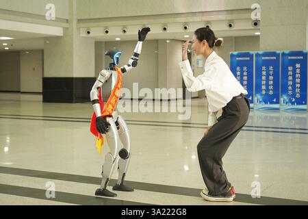 A Unitree G1 humanoid robot greets passers-by during the MWC26 in ...